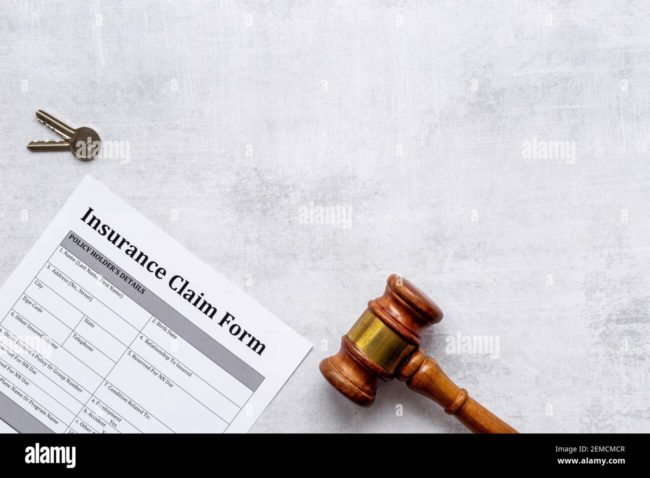 Insurance claim form with judge gavel . Top view Stock Photo - Alamy