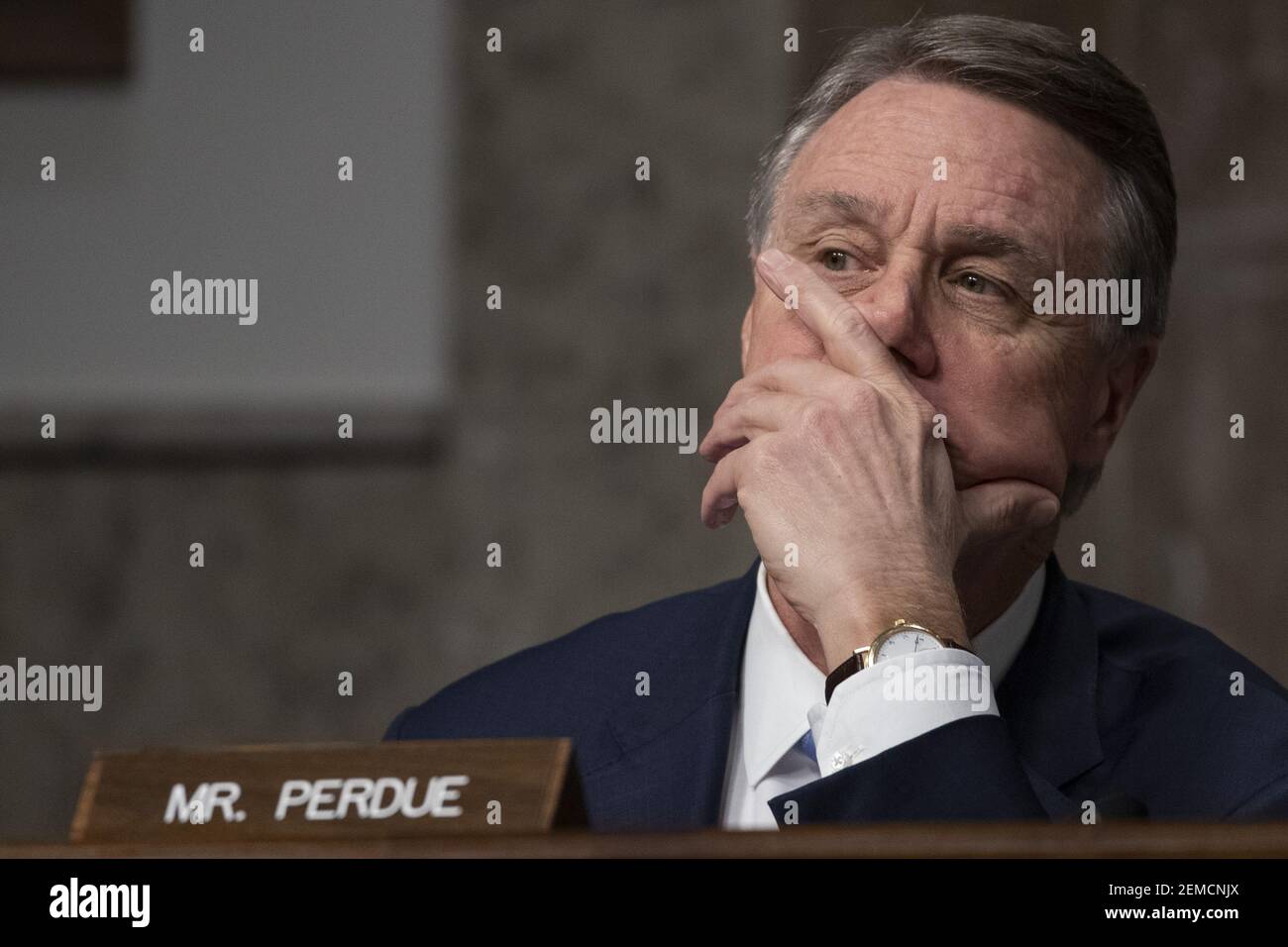 Senator David Perdue, Republican of Georgia, listens to testimony ...