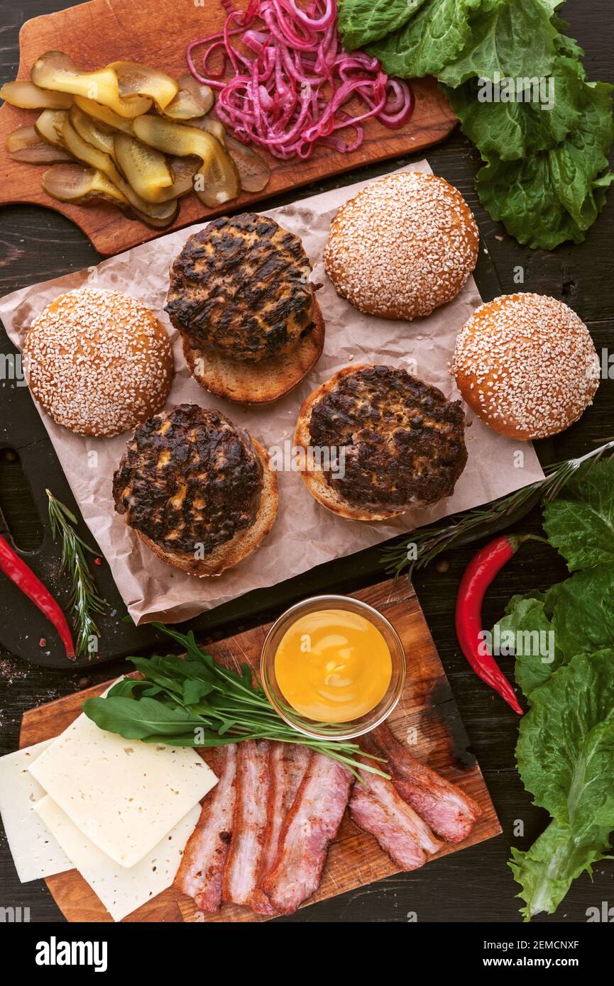 Ingredients for a tasty and juicy burger home in a rustic style with a ...