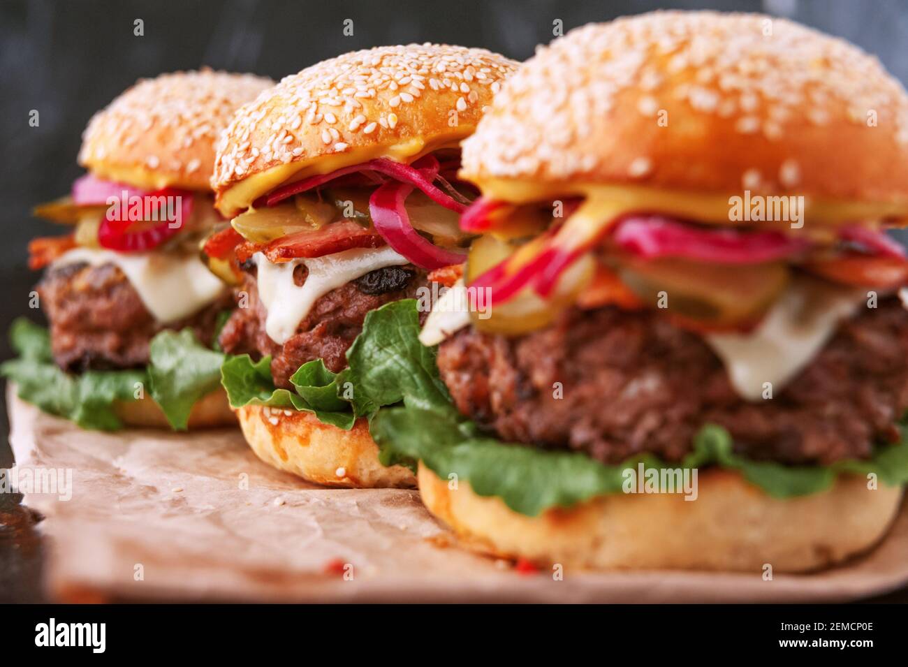 a delicious and juicy burger home in a rustic style with a big chop of ...