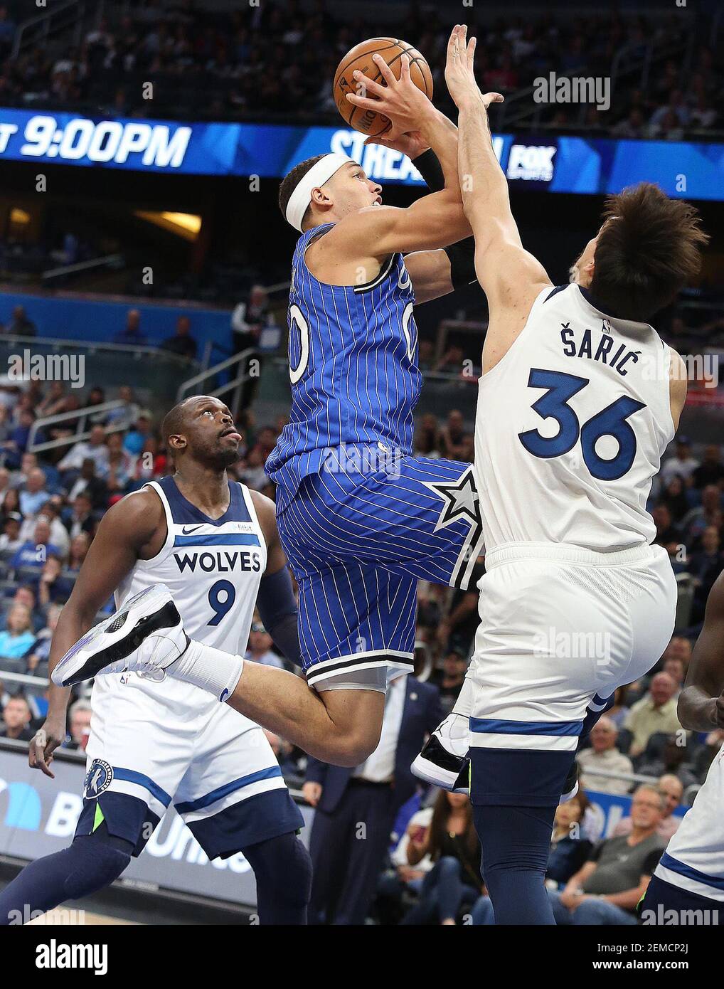 The Orlando Magic's Aaron Gordon (00) shoots between the Minnesota ...