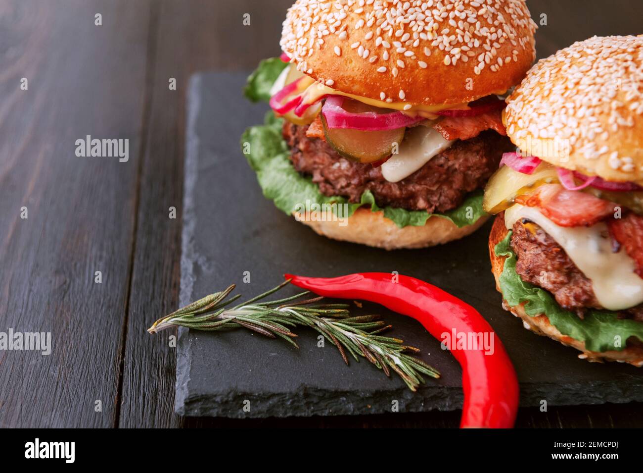 a delicious and juicy burger home in a rustic style with a big chop of ...