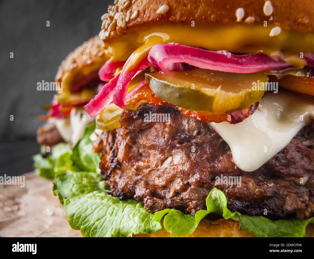 a delicious and juicy burger home in a rustic style with a big chop of ...