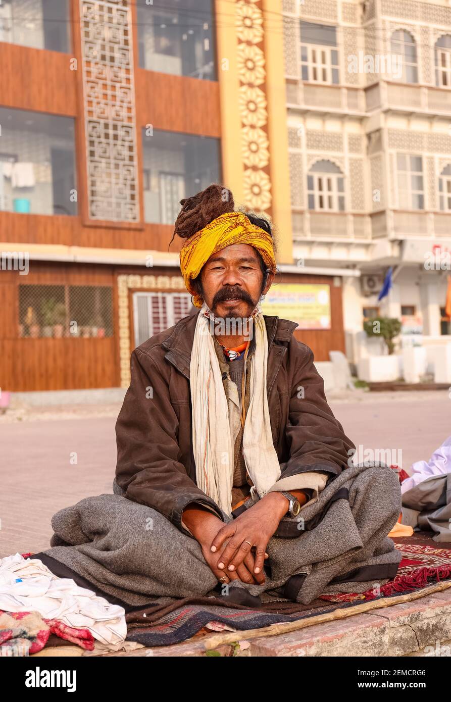 Indian Sadhu in traditional saffron dress participating in Kumbh ...
