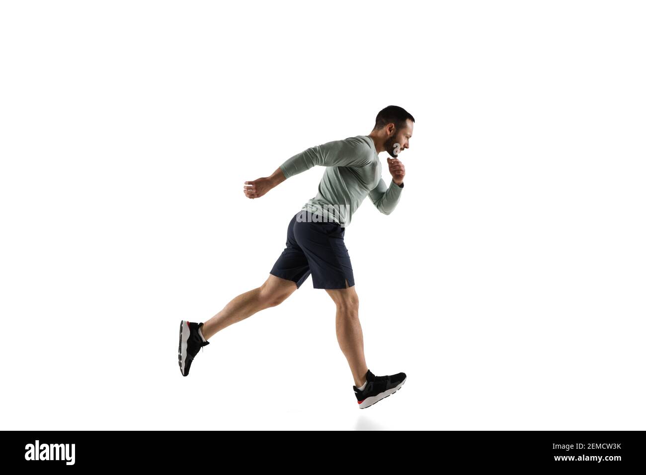 Run. Young caucasian male model in action, motion isolated on white ...