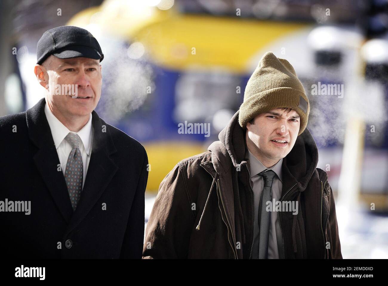 Kenneth Lilly, right, walks into the Hennepin County Public Safety ...