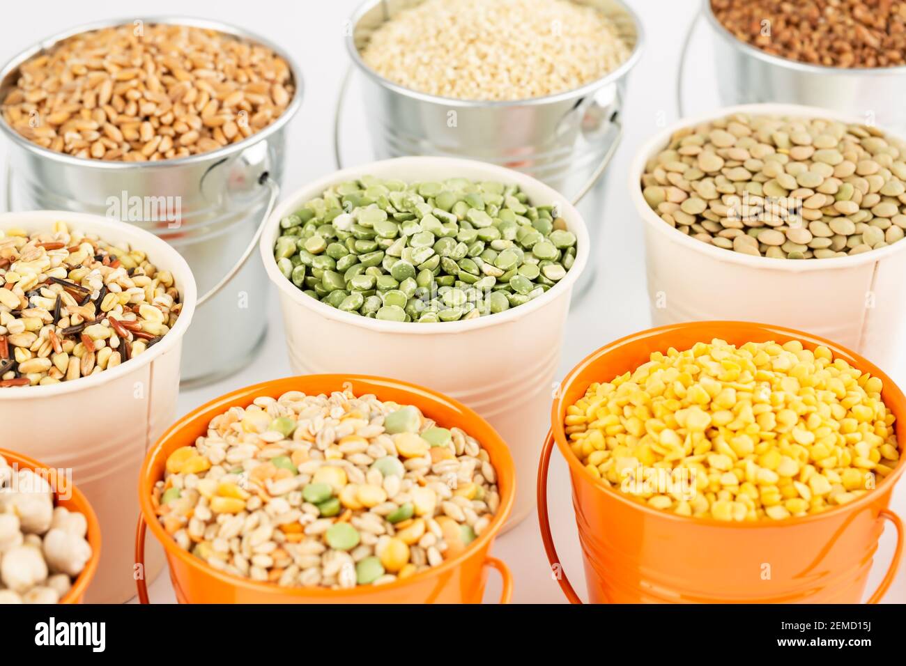 The collection of different groats in the metallic buckets. Quinoa ...