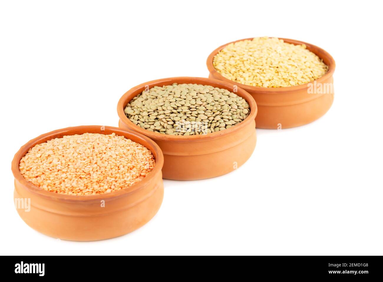 Colorful lentils in the ceramic bowls isolated on white background ...