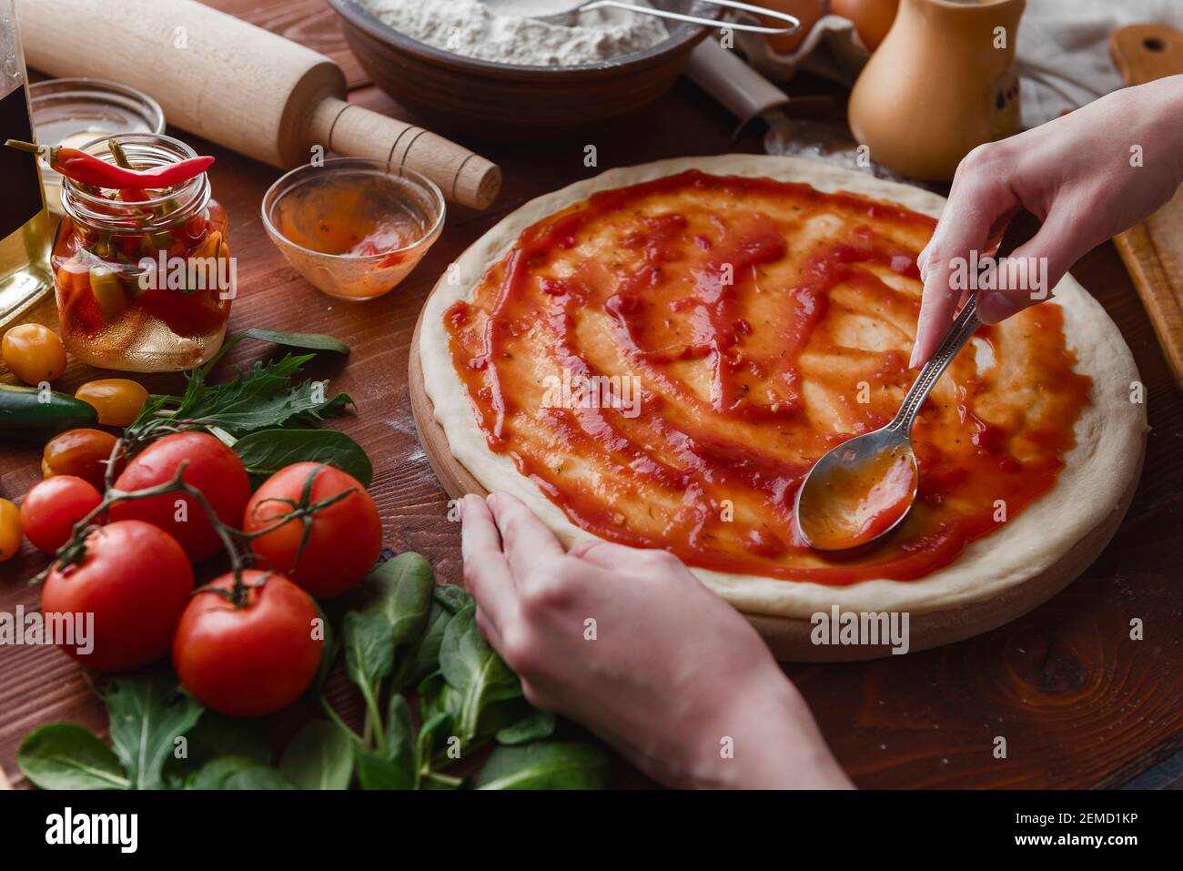 Step-by-step boss makes a pizza margarita. Dough and pizza ingredients ...