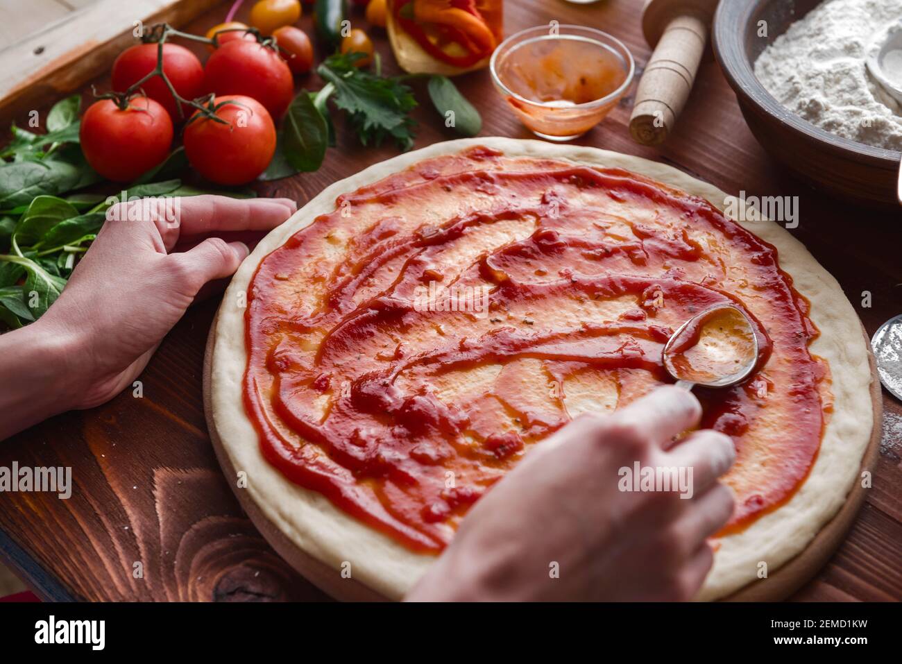 Step-by-step boss makes a pizza margarita. Dough and pizza ingredients ...