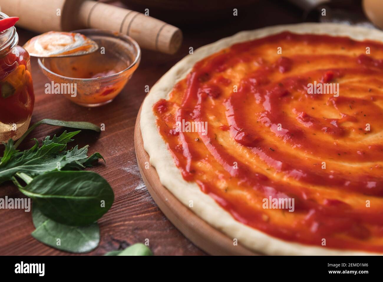 Step-by-step boss makes a pizza margarita. Dough and pizza ingredients ...