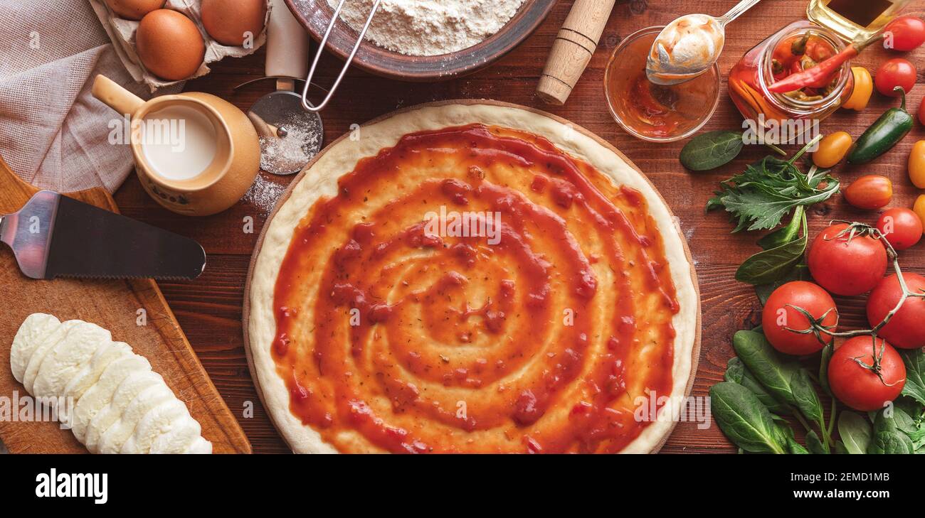 Step-by-step boss makes a pizza margarita. Dough and pizza ingredients ...