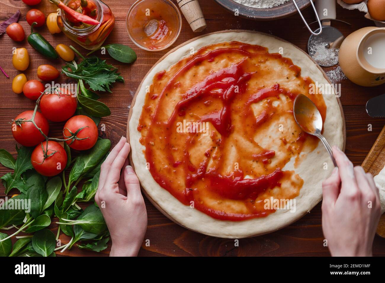 Step-by-step boss makes a pizza margarita. Dough and pizza ingredients ...