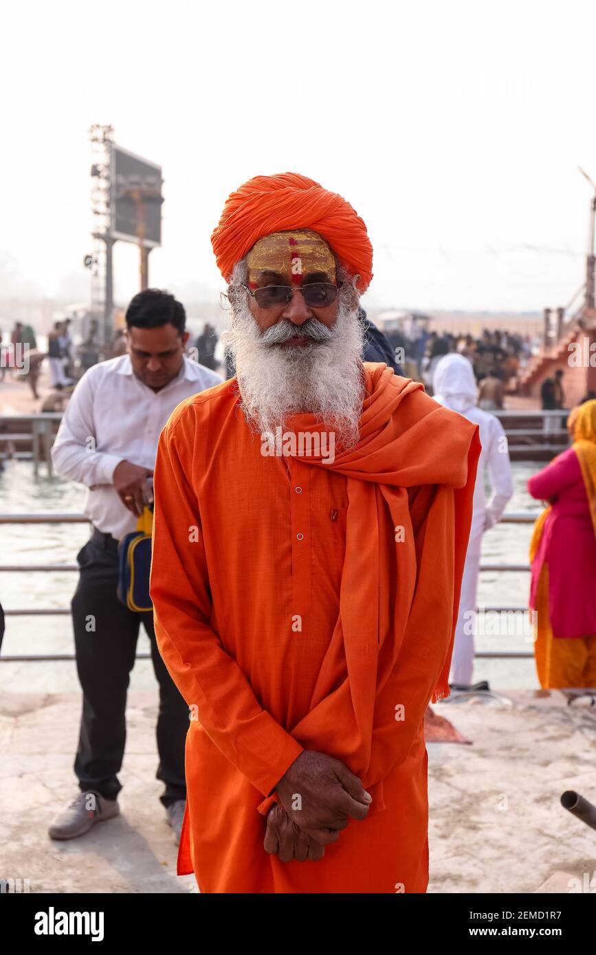 Indian Sadhu in traditional saffron dress participating in Kumbh ...