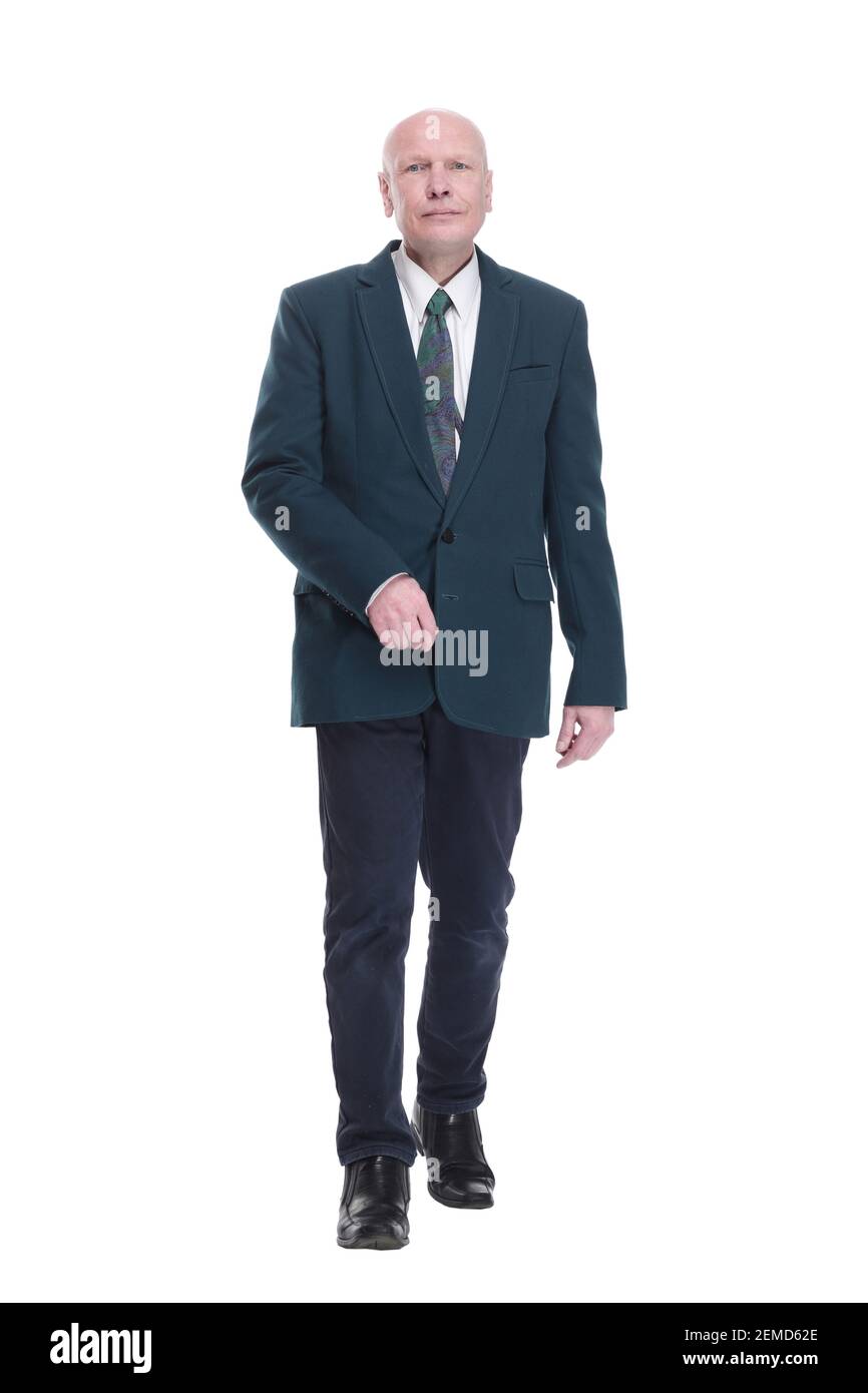 Mature business man striding forward. isolated on a white background ...