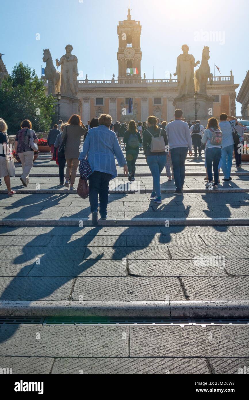 Rome, Italy - Oct 03, 2018: Tourists climb the Michelangelo's ...