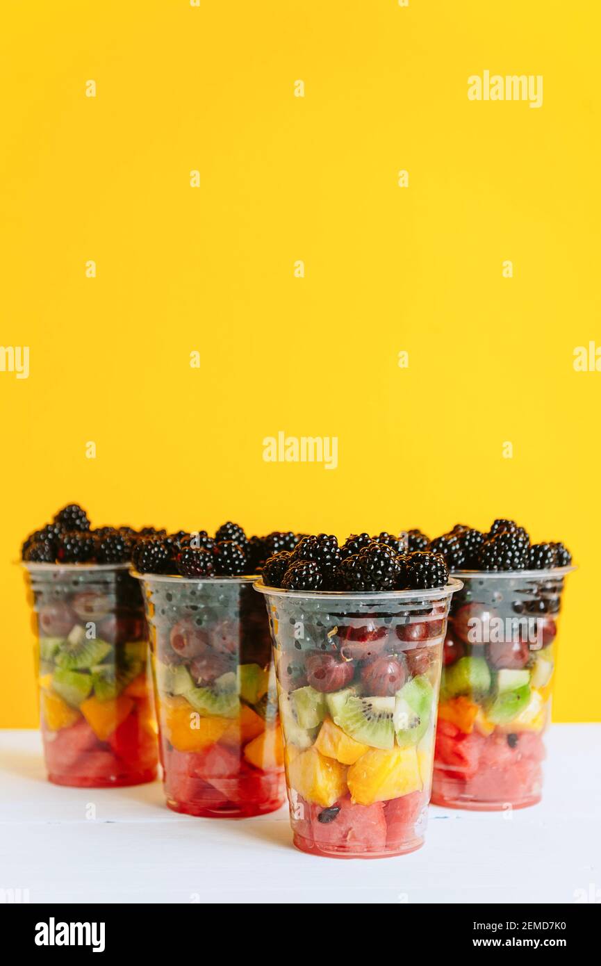 Fruit in a plastic cup Stock Photo - Alamy