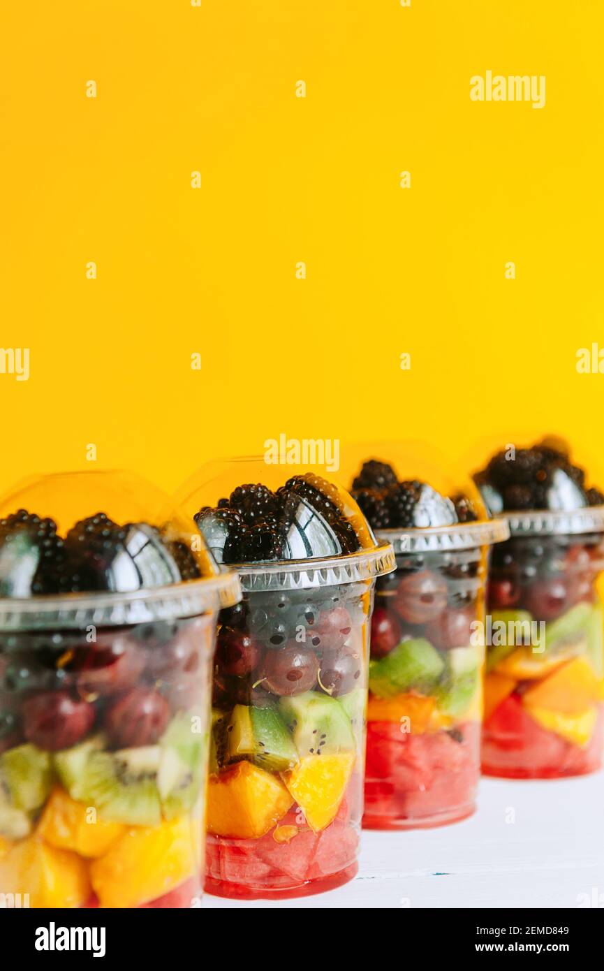 Fruit in a plastic cup Stock Photo - Alamy