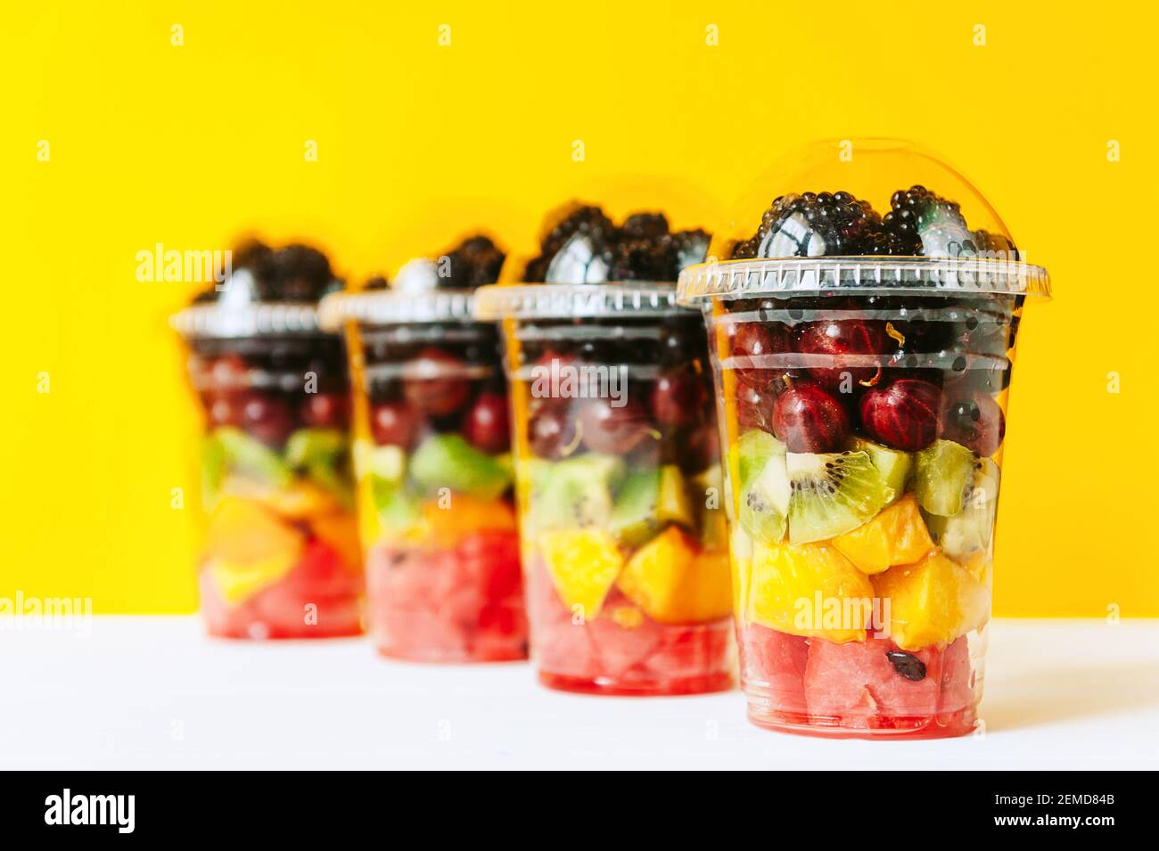 Fruit in a plastic cup Stock Photo - Alamy