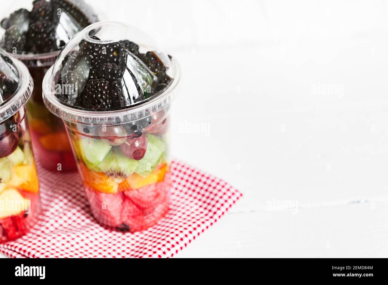 Fruit in a plastic cup Stock Photo - Alamy