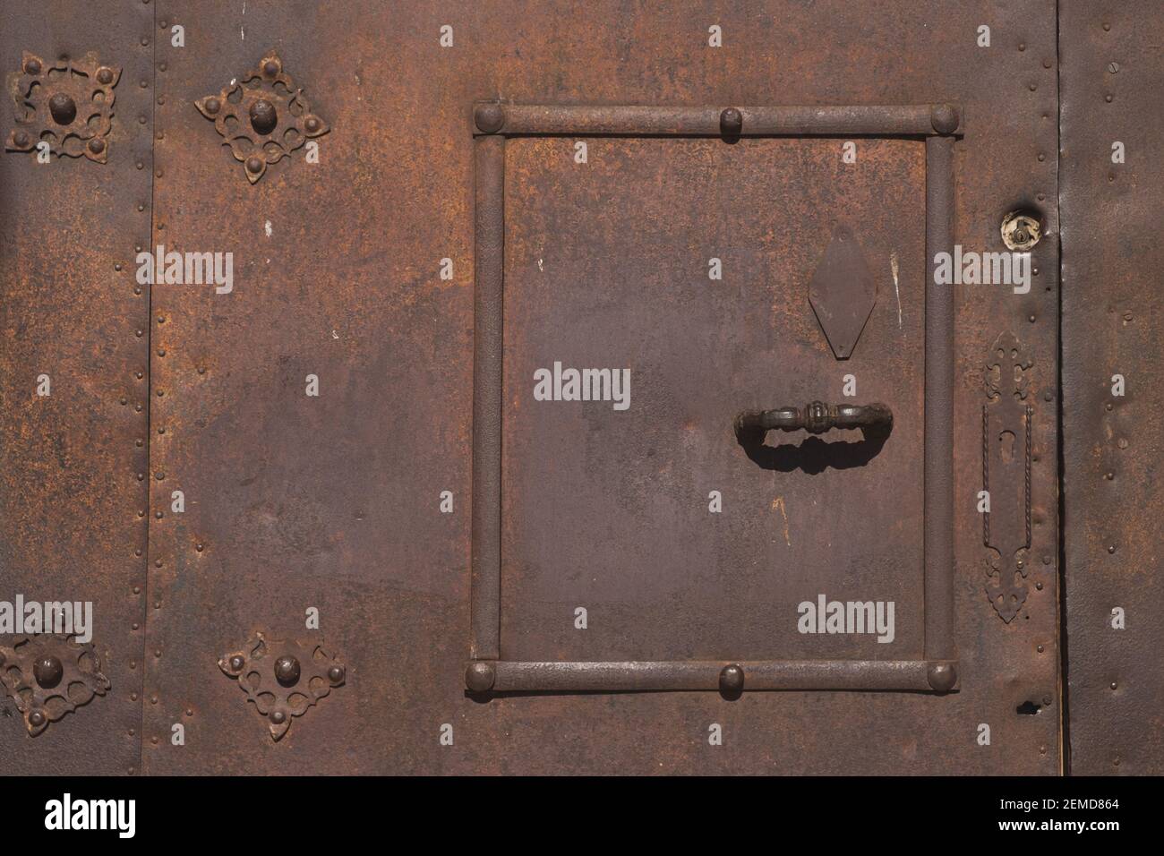 Antique rusted iron door with decoration Stock Photo - Alamy