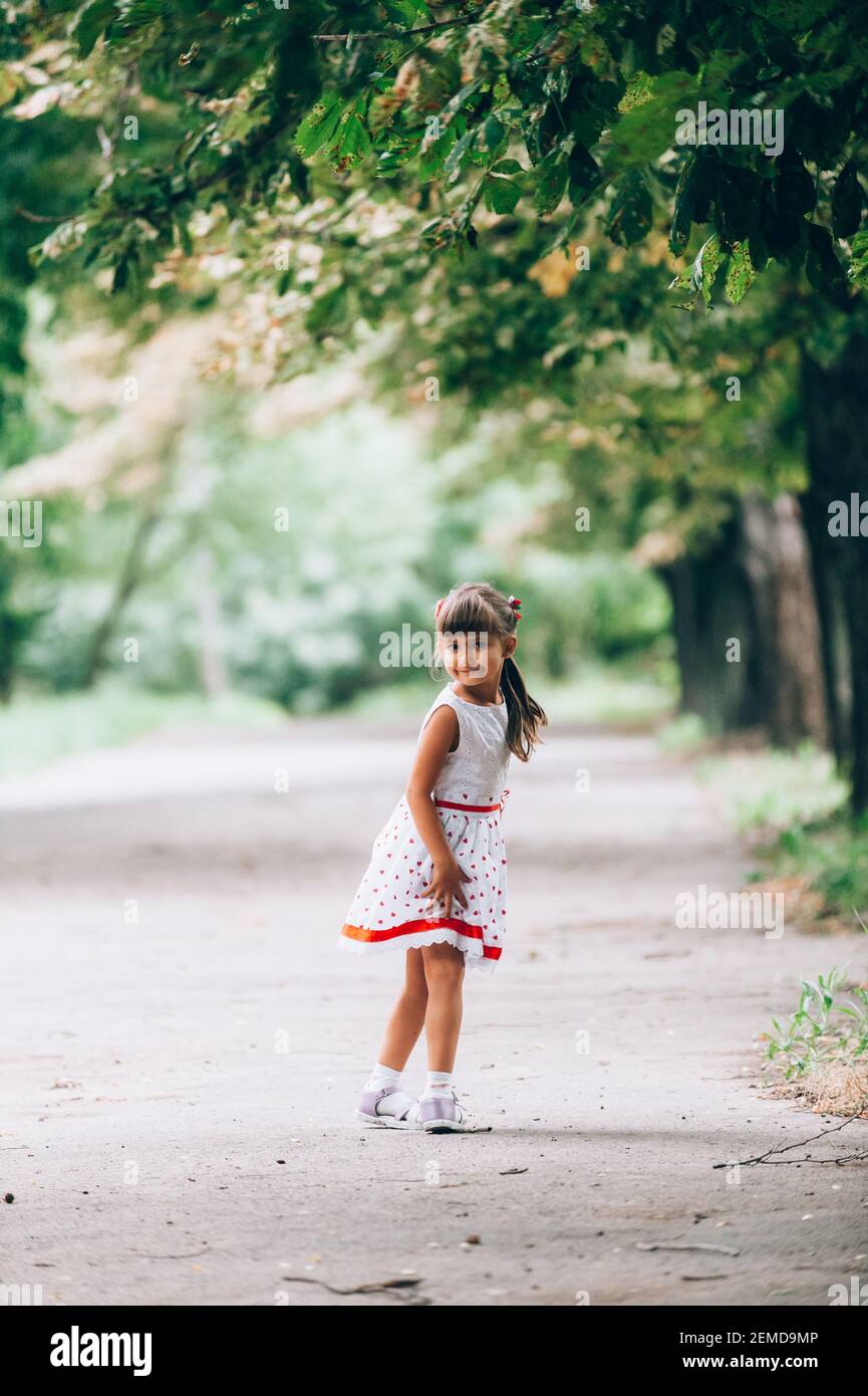 Little girl is running around Stock Photo - Alamy