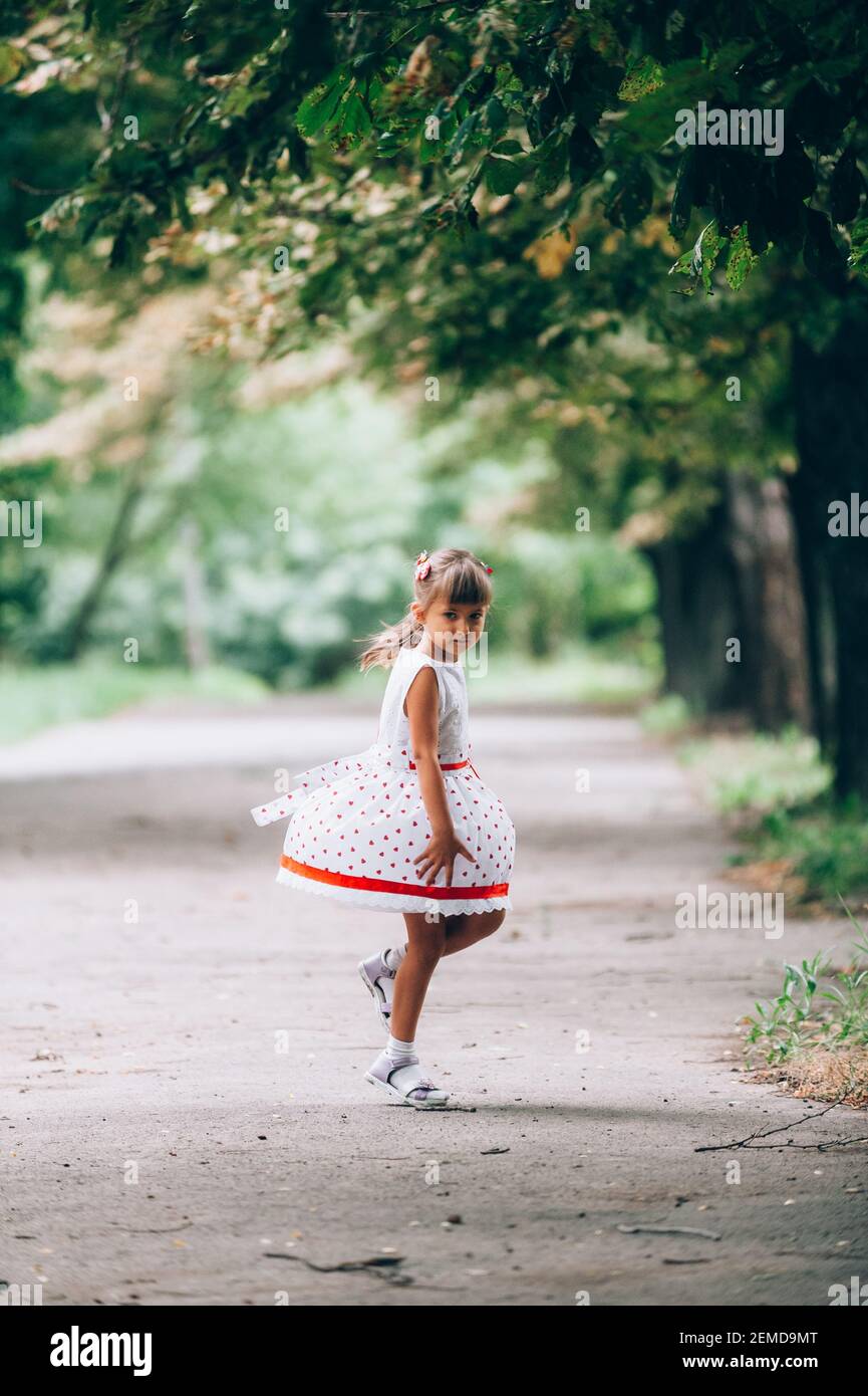 Little girl is running around Stock Photo - Alamy