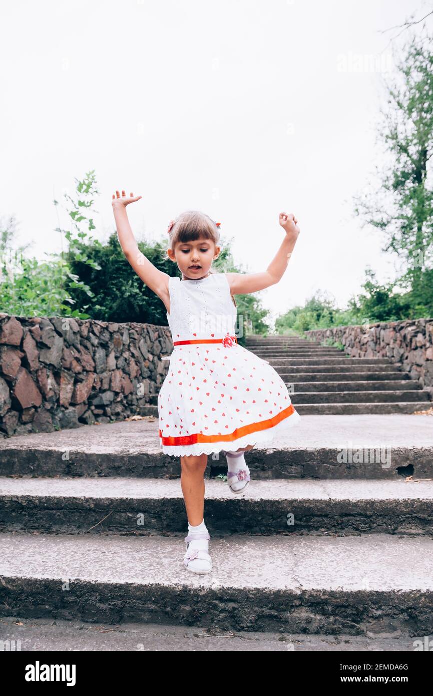 Little girl is running around Stock Photo - Alamy