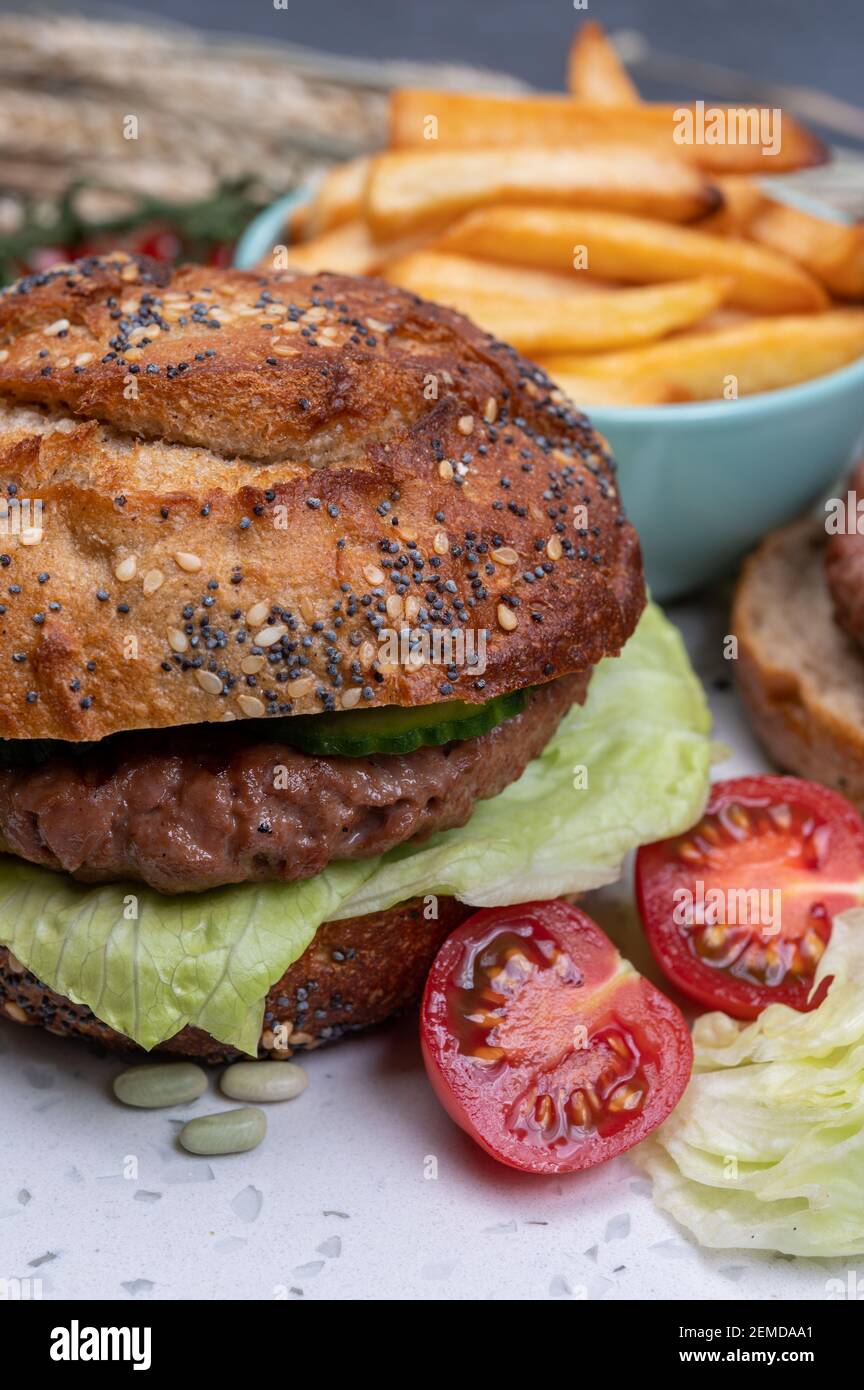 Making tasty vegetarian vegan lunch with hamburger made from plant ...