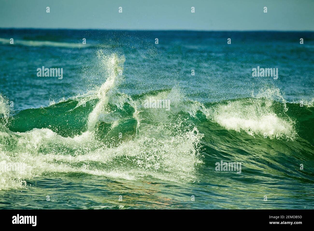 wave in the beach Stock Photo - Alamy