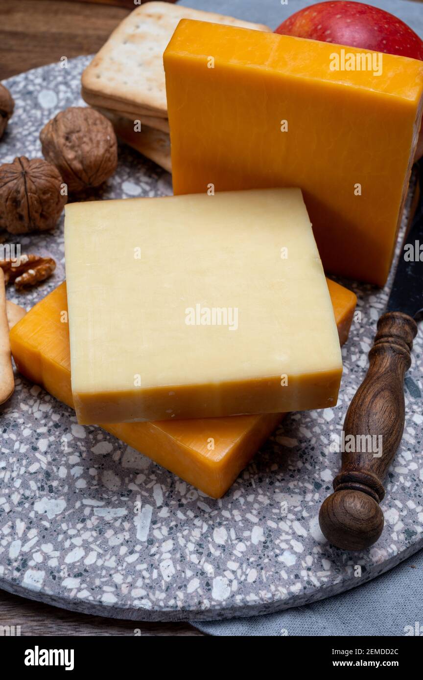 Cheese collection, orange and yellow smoked British cheese from England ...