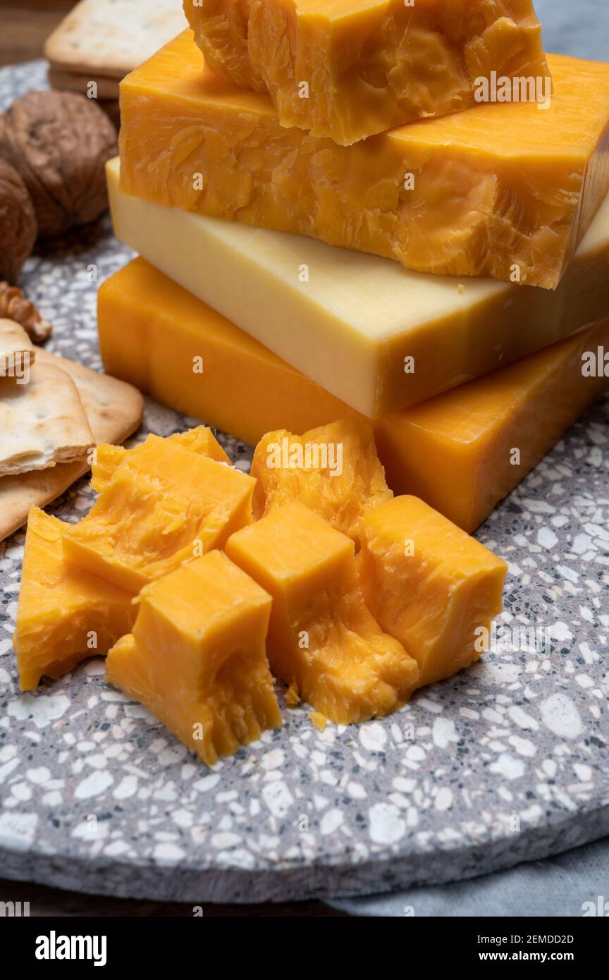 Cheese collection, orange and yellow smoked British cheese from England ...