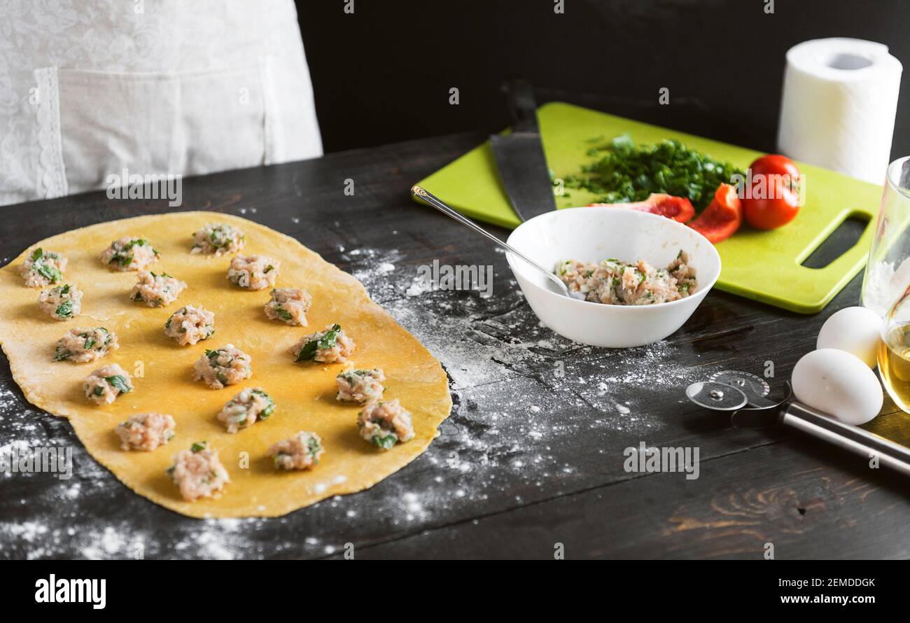 Woman chef cooks step by step the traditional ravioli Stock Photo - Alamy