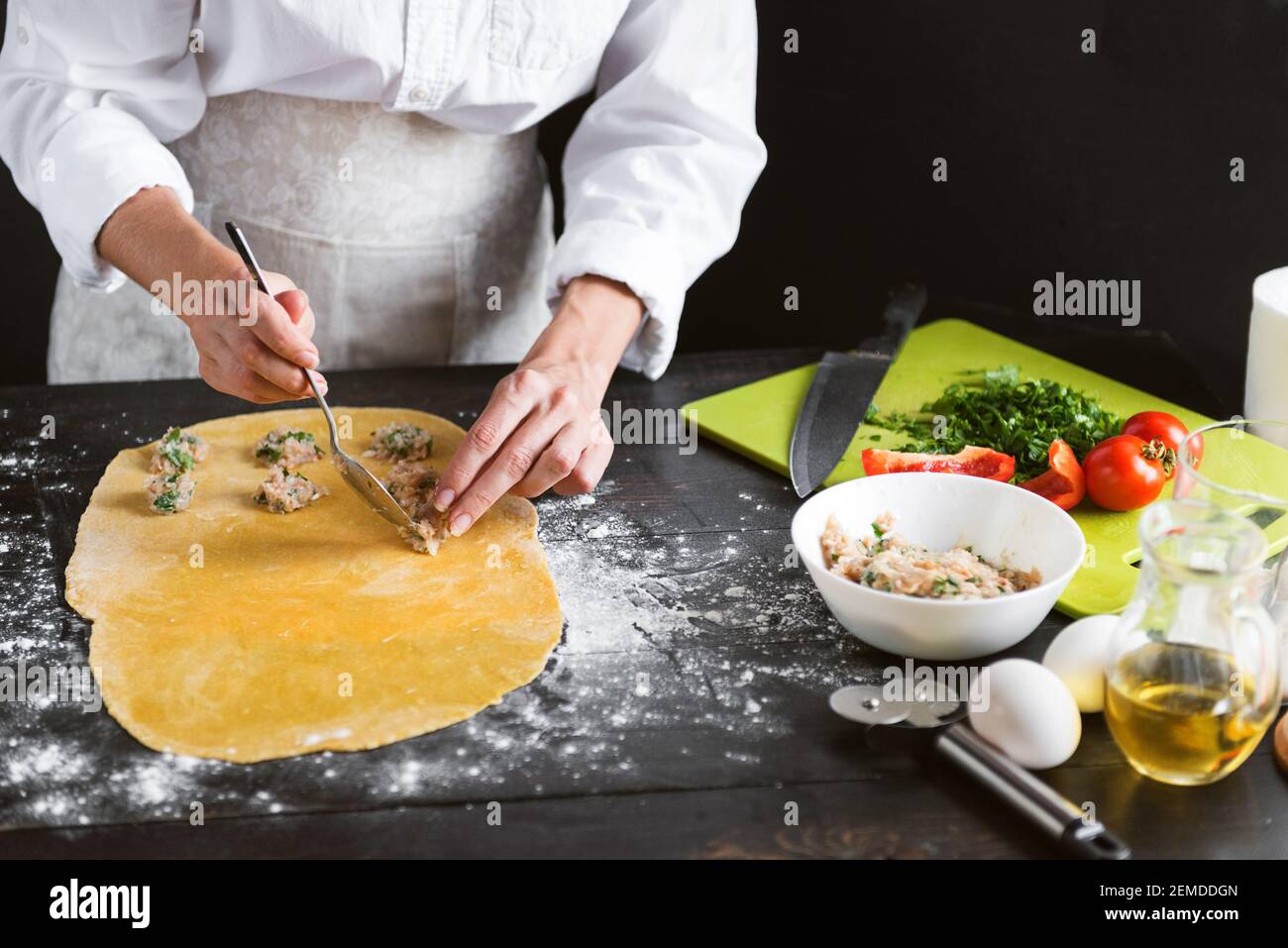 Woman chef cooks step by step the traditional ravioli Stock Photo - Alamy