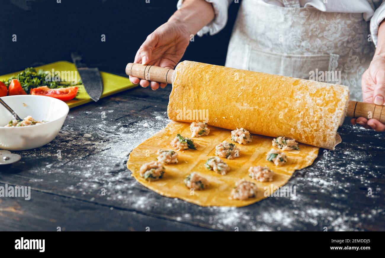 Woman chef cooks step by step the traditional ravioli Stock Photo - Alamy