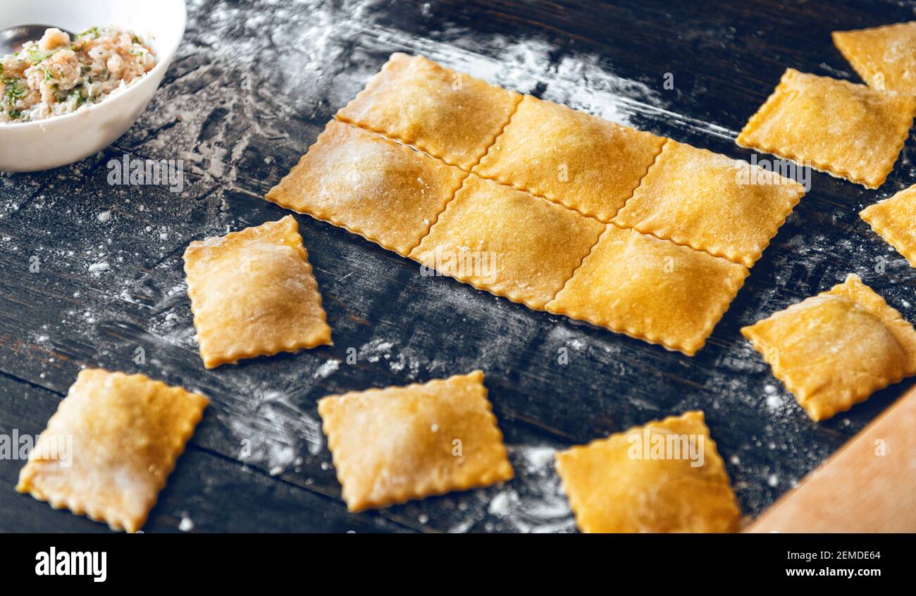 Woman chef cooks step by step the traditional ravioli Stock Photo - Alamy