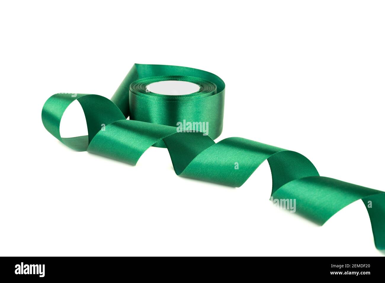 Green silk ribbon reel isolated on white background Stock Photo - Alamy