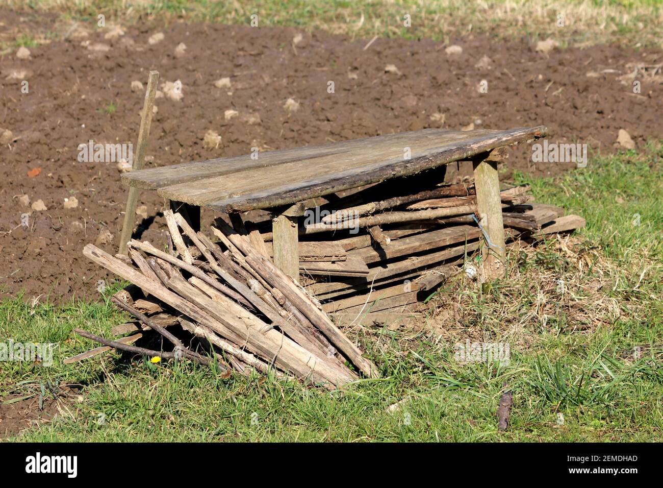 Stacked old broken heavily used homemade wooden garden stakes mixed ...
