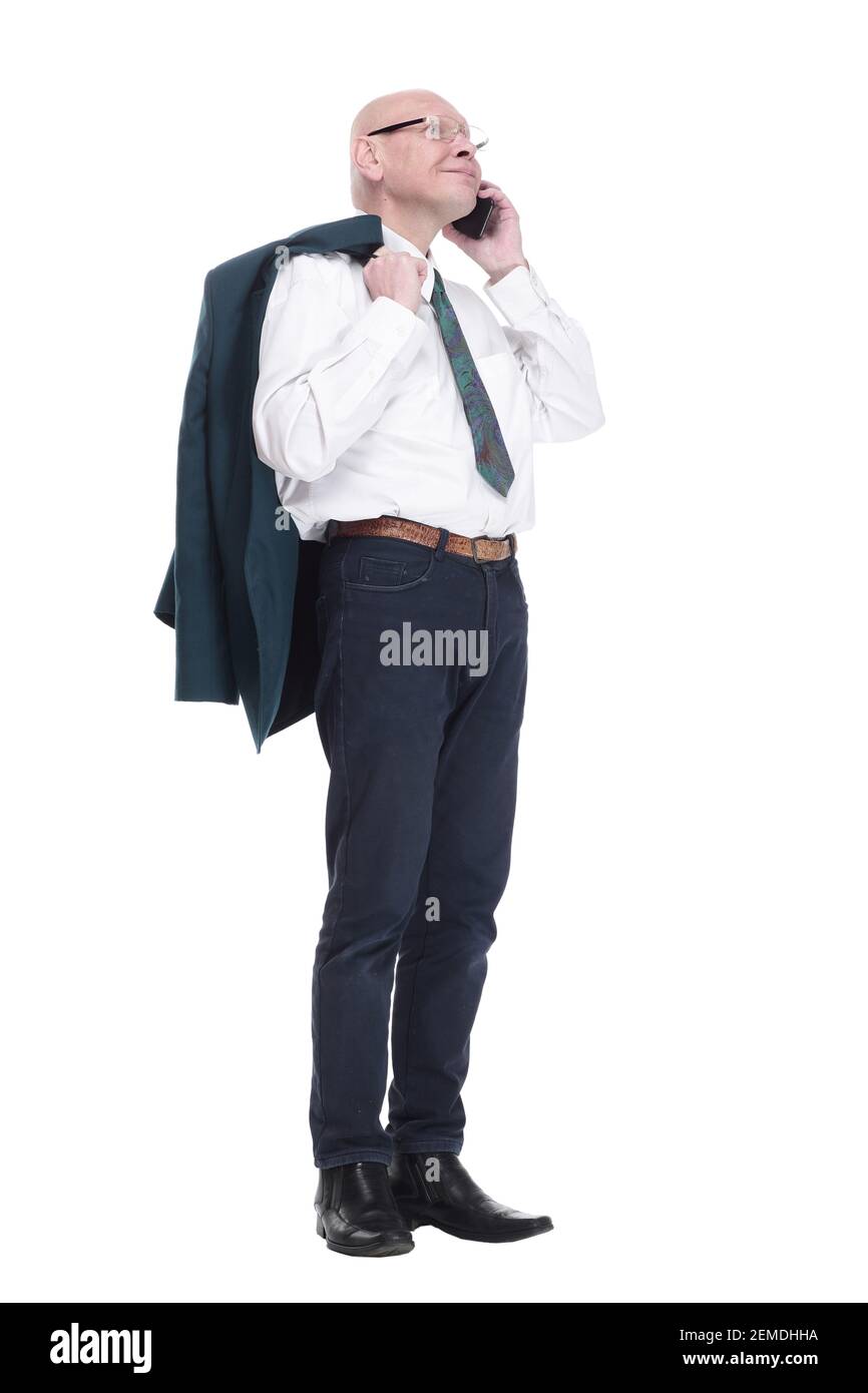 man with a jacket over his shoulder reading a message on his smartphone ...