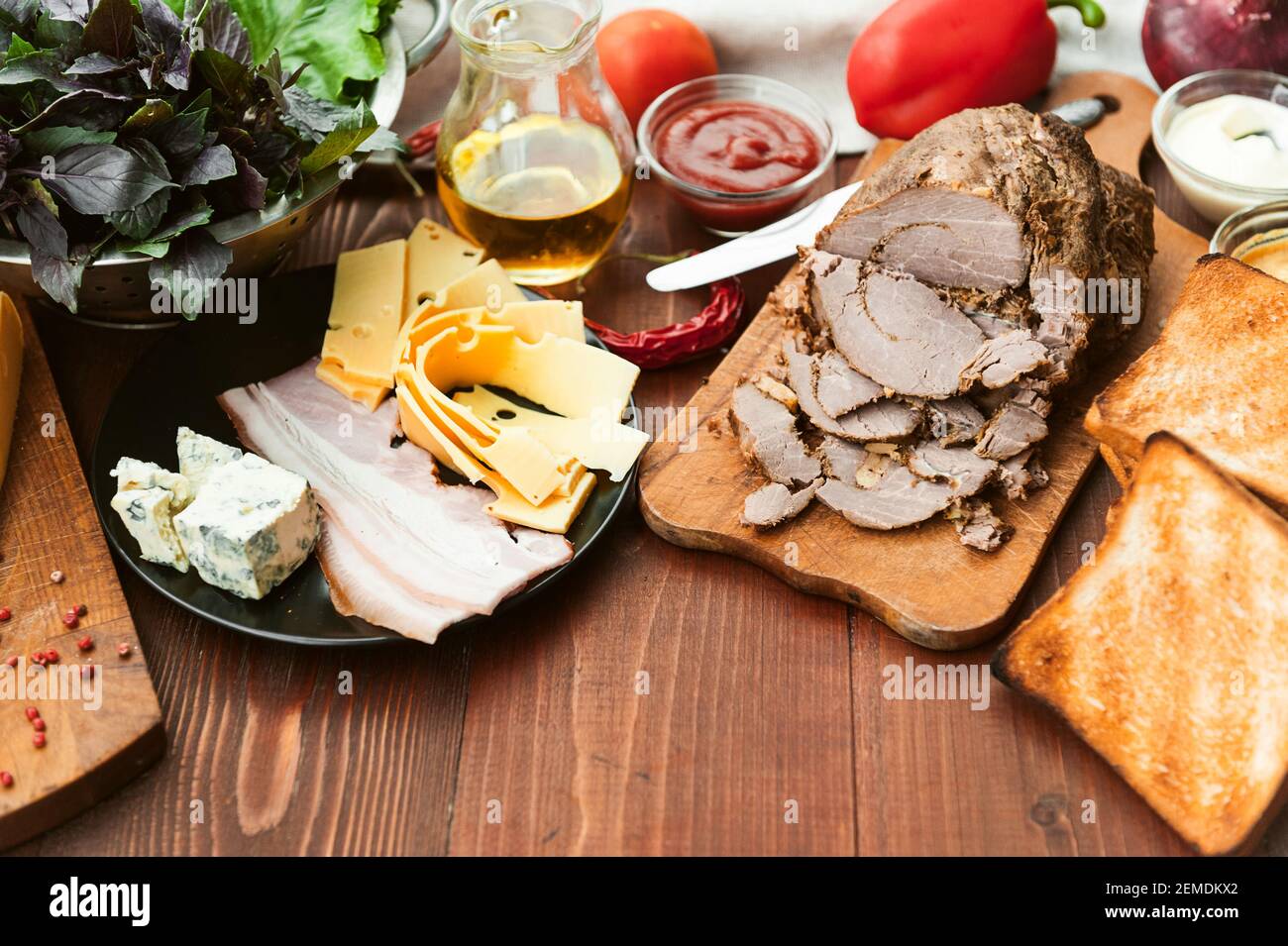 meat, toast and vegetables for a sandwich Stock Photo - Alamy