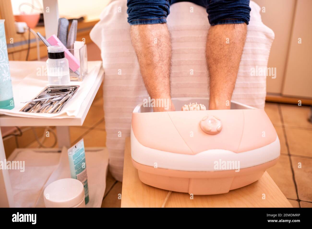 Feet treatment in a foot spa tub, men’s pedicure Stock Photo - Alamy