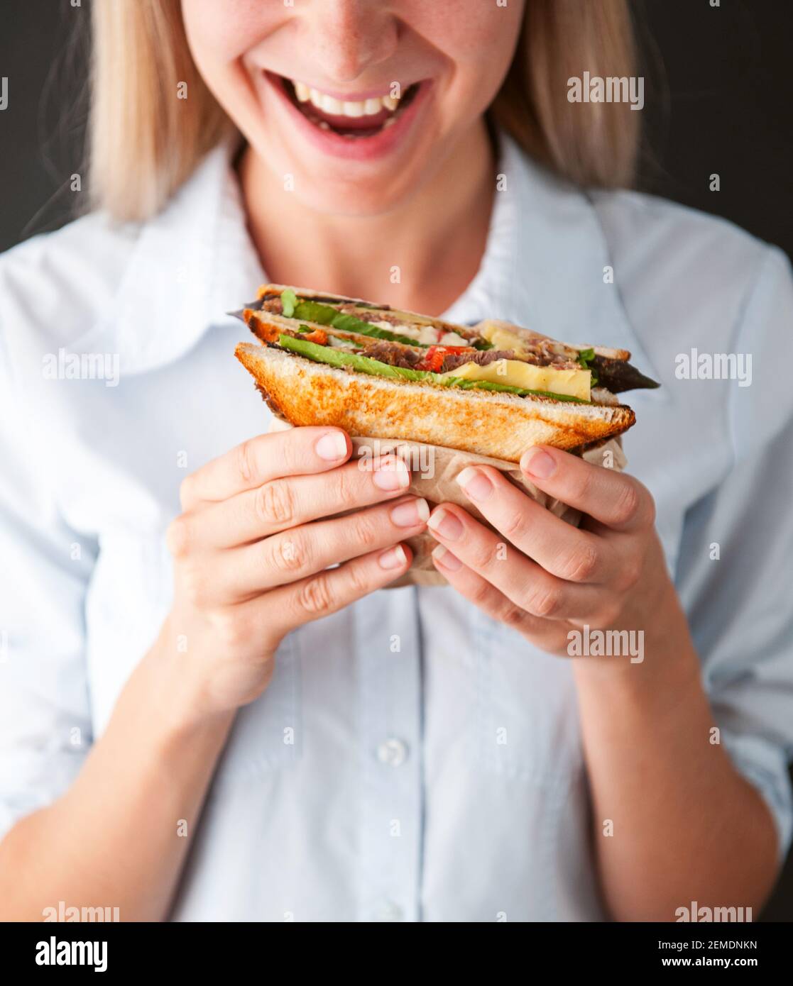 girl looks at a delicious sandwich Stock Photo - Alamy