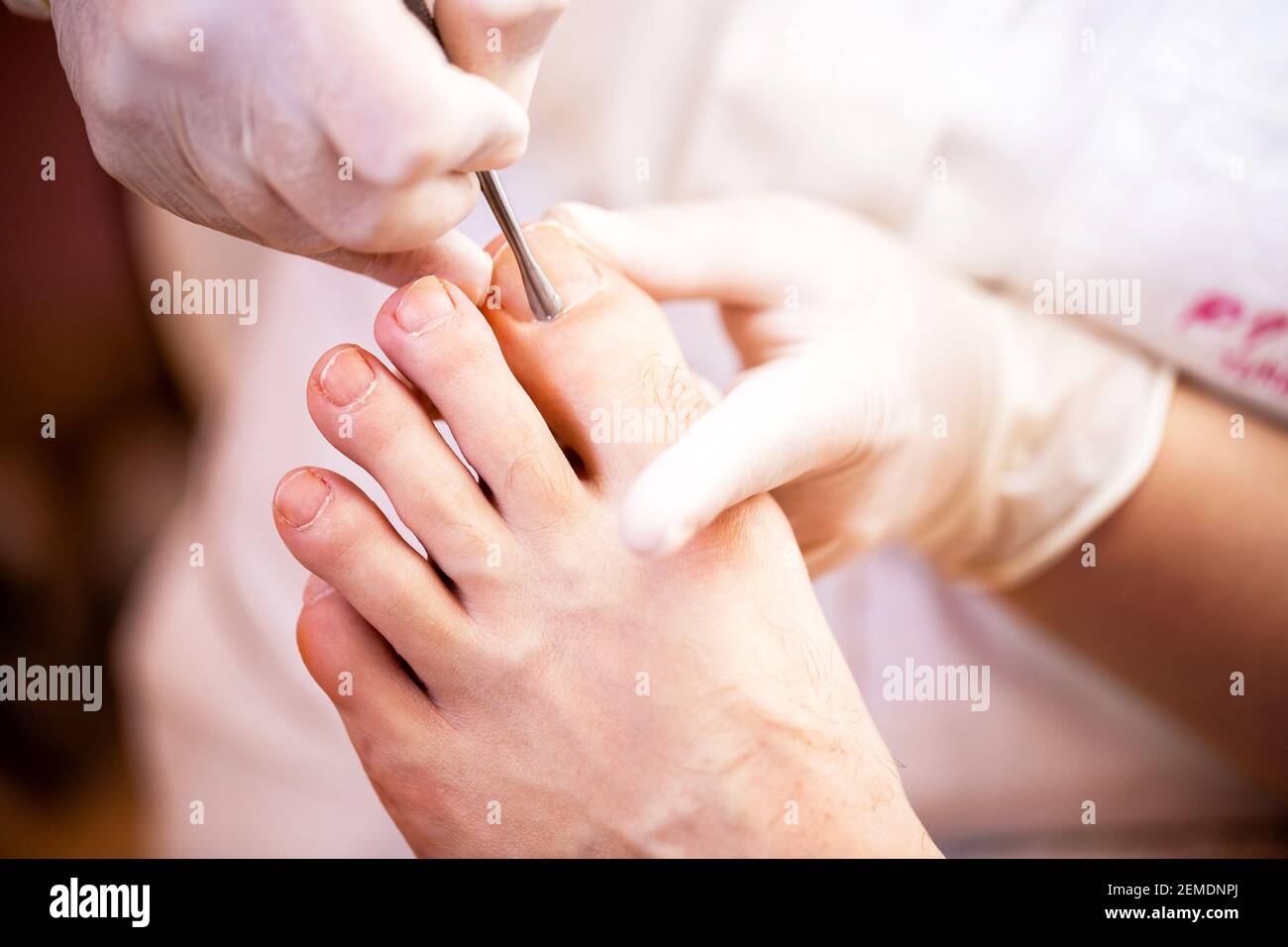 Feet nail cuticle treatment in close up with cuticle nail pusher Stock ...