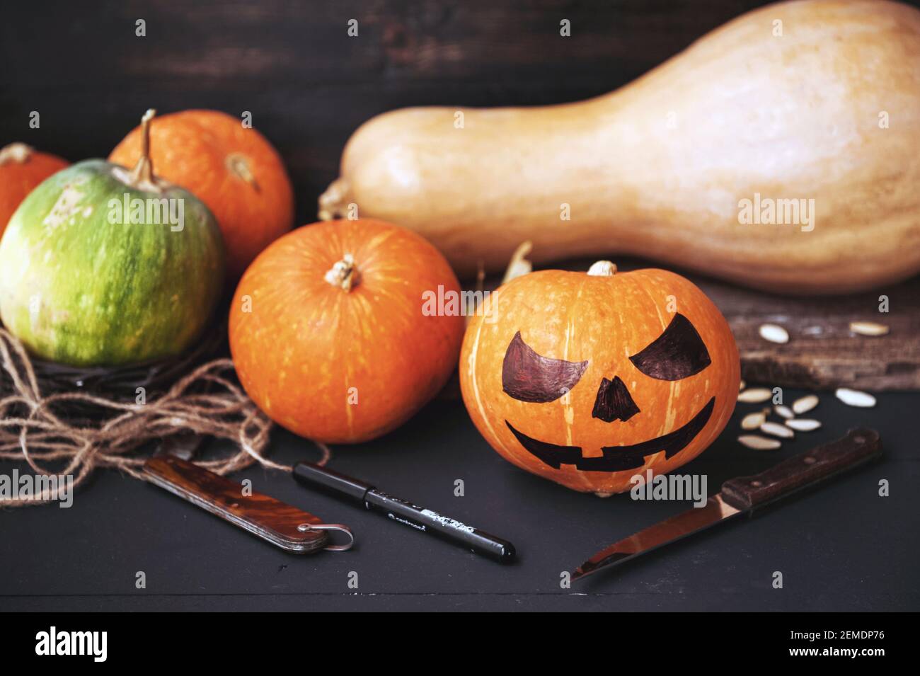 pumpkin with painted eyes and mouth Stock Photo - Alamy