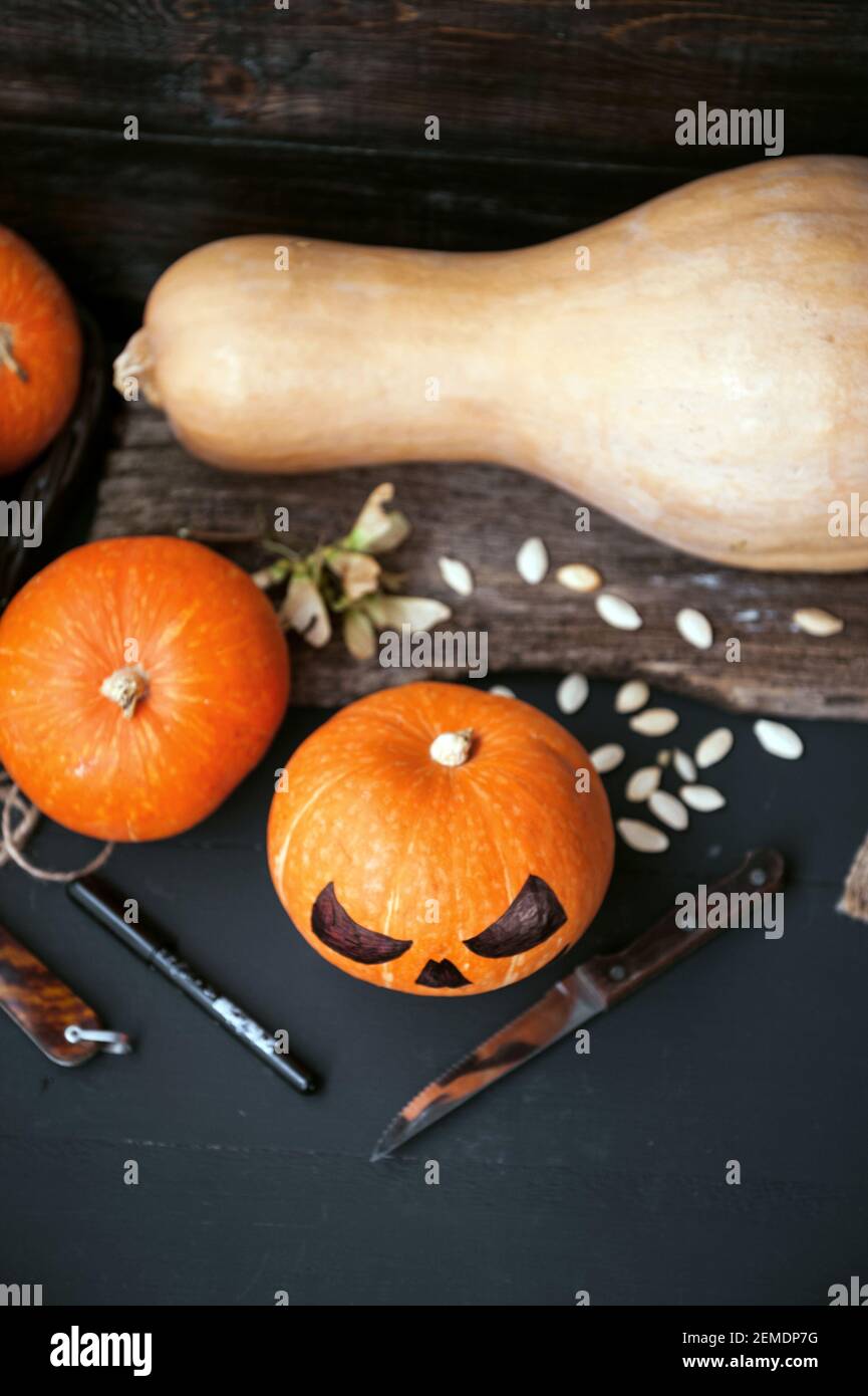 pumpkin with painted eyes and mouth Stock Photo - Alamy