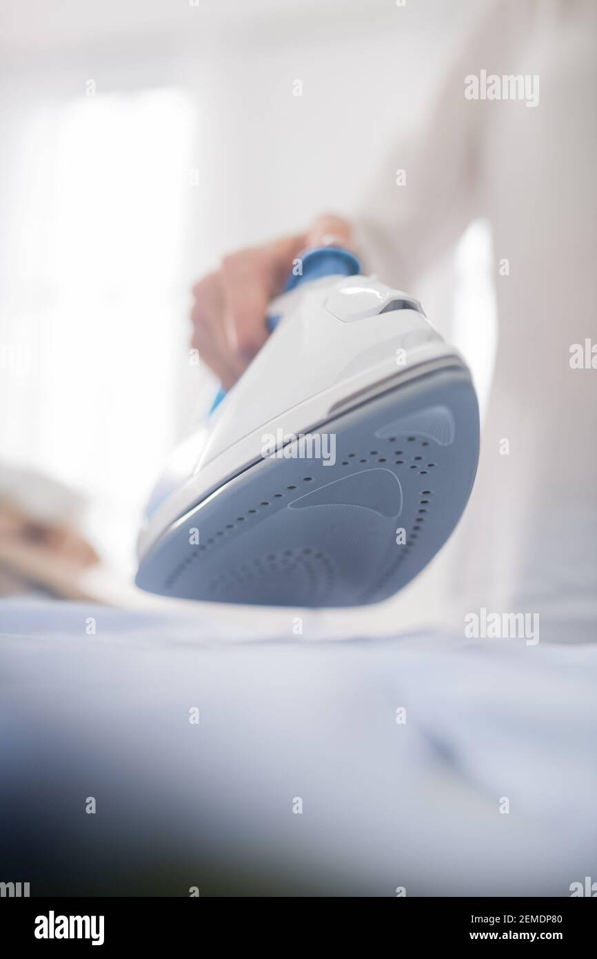 Iron in hand hi-res stock photography and images - Alamy