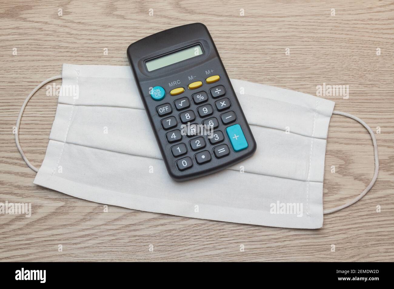 Face mask on calculator hi-res stock photography and images - Alamy
