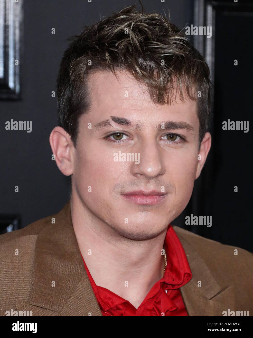 LOS ANGELES, CA, USA - FEBRUARY 10: Singer Charlie Puth wearing a Prada ...