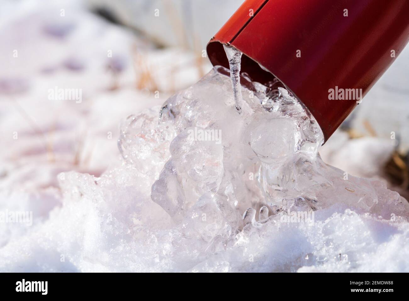 Frozen in the form of a pile of ice water from the red pipes of the ...