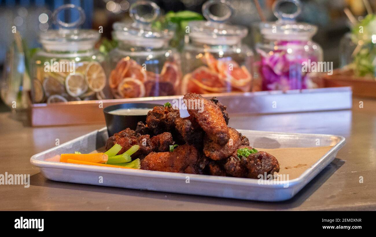 Smoked wings at Que Whiskey Kitchen. (Photo by Lindsay Bukowinski ...